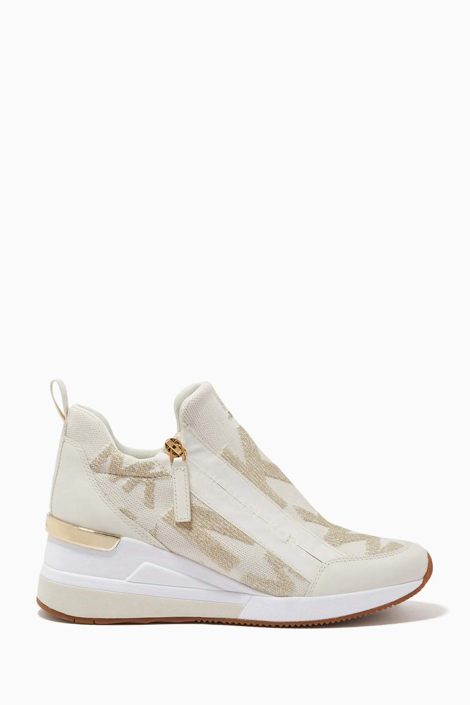 Shop Michael Kors Gold Willis Wedge Sneakers in Stretch Knit for Women ...